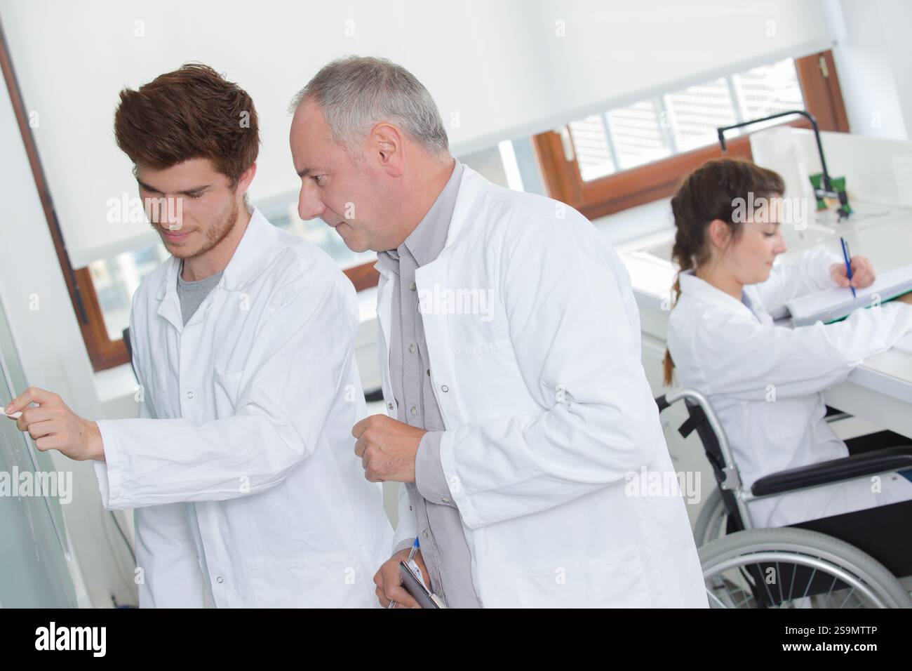young scientist works in modern chemistry lab Stock Photo - Alamy