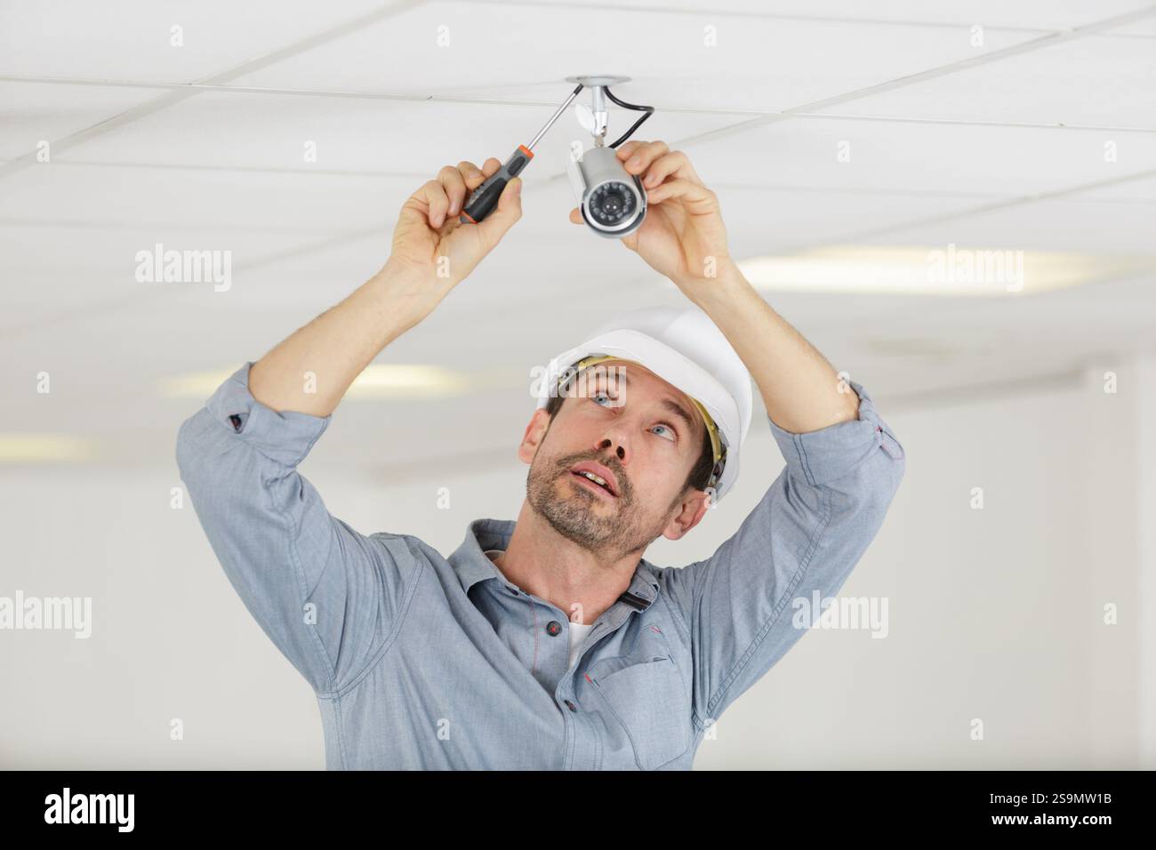 technician installing cctv system in elevetor area Stock Photo - Alamy
