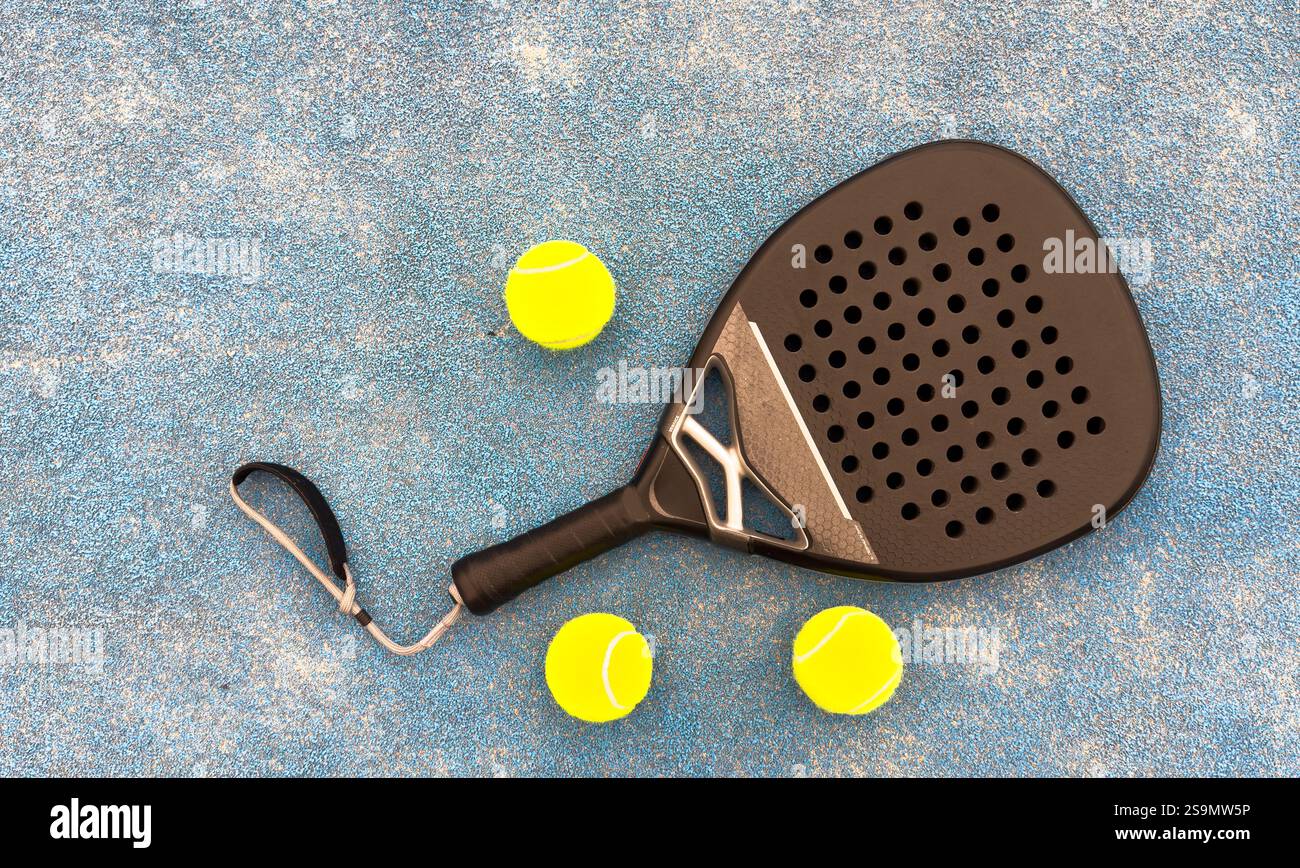 Padel tennis racket. Background with copy space. Sport court and balls ...