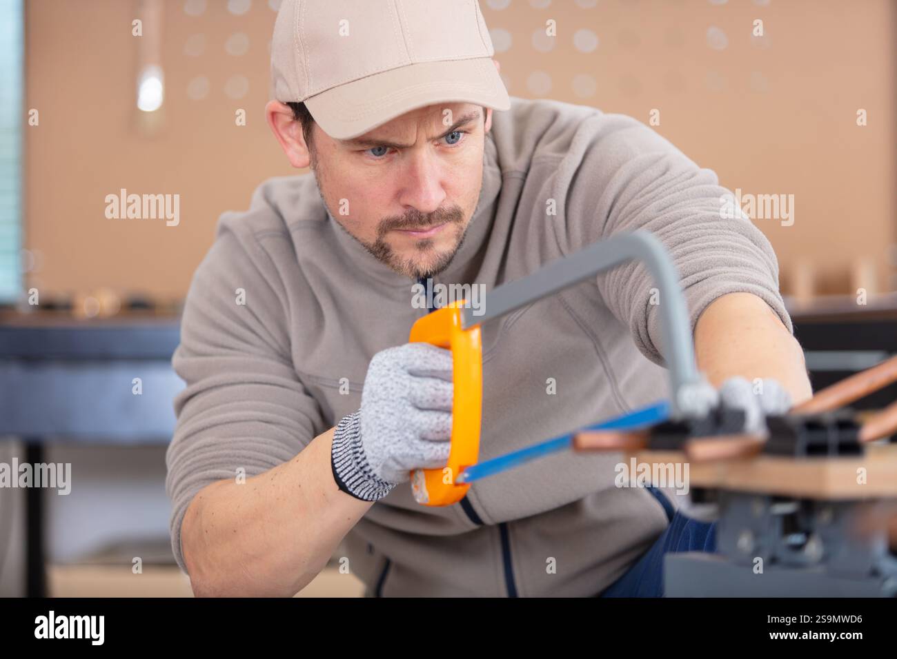 Closeup female carpenter cutting wood hi-res stock photography and ...