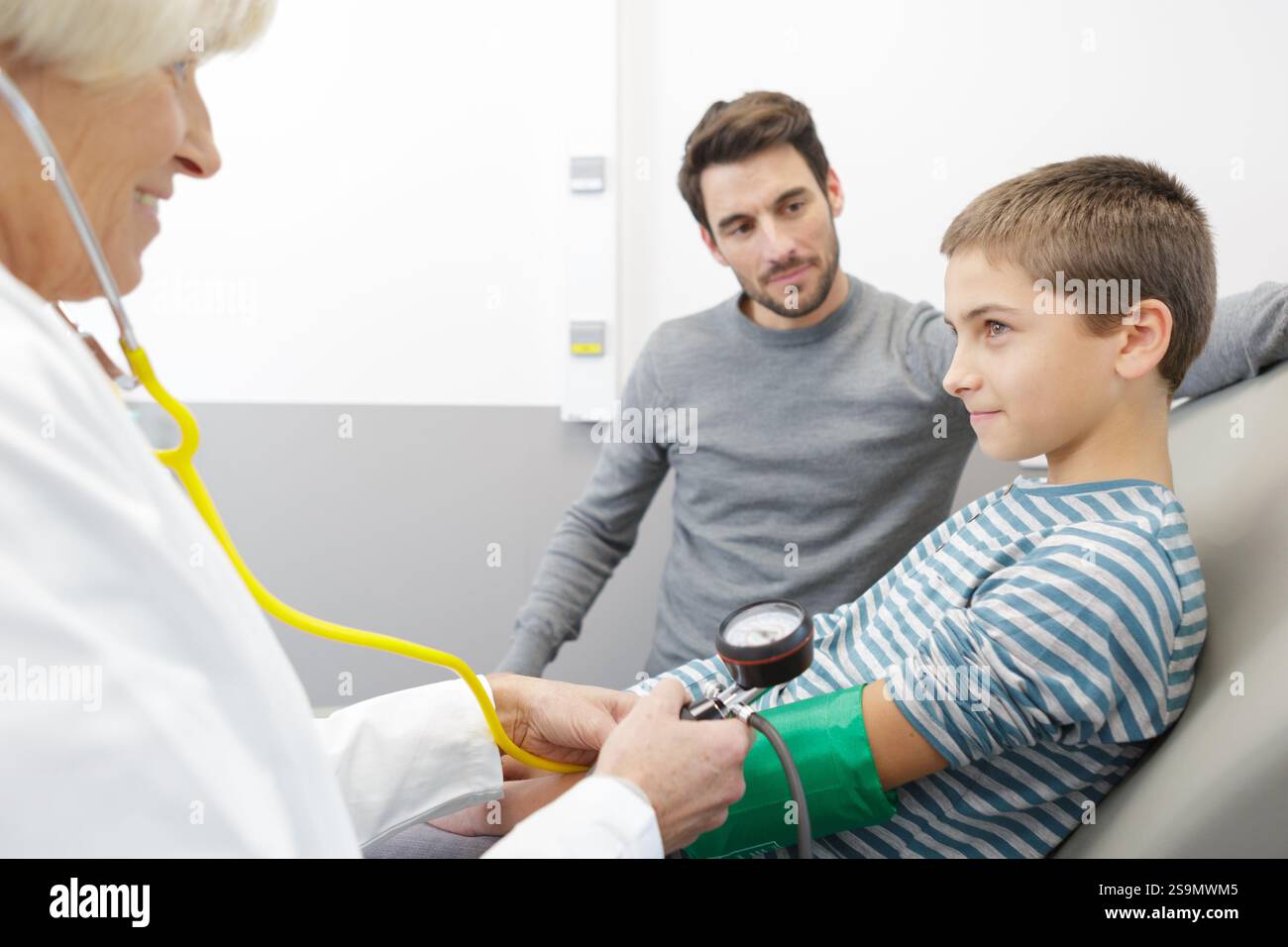 little boy visiting doctor in hospital measuring blood pressure Stock ...