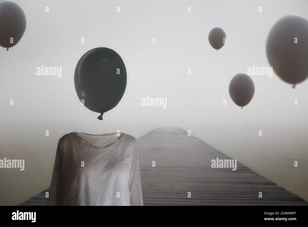 Headless woman surrounded by black balloons on a pier overlooking the ...