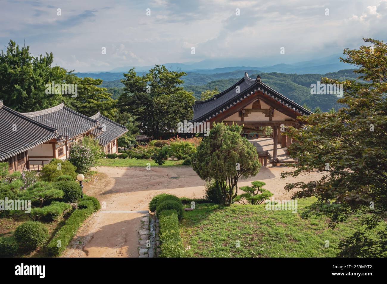Traditional Korean architecture and lush green forest and mountains at ...