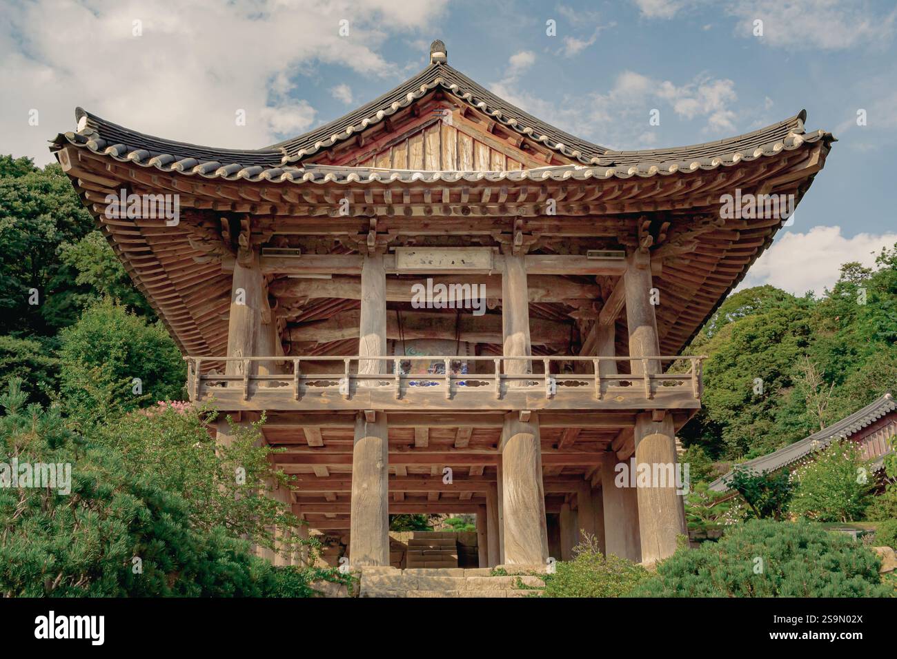 Traditional Korean architecture and lush green forest and mountains at ...