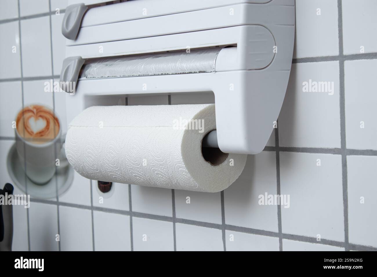 A kitchen paper towel roll hanging on the wall in the kitchen Stock ...
