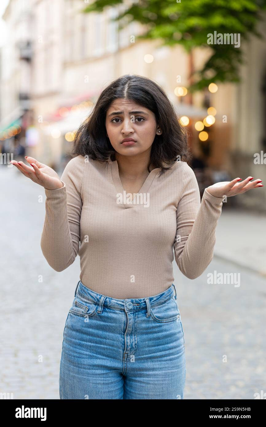 What. Why. Surprised frustrated Indian woman raising hands asking ...