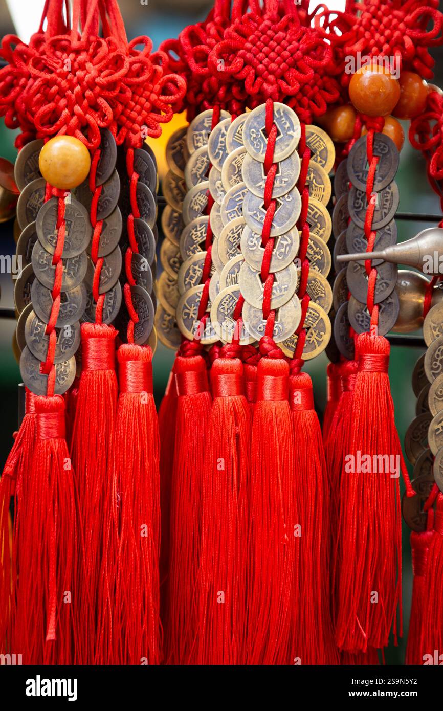 Feng shui coins with red ribbons Stock Photo - Alamy