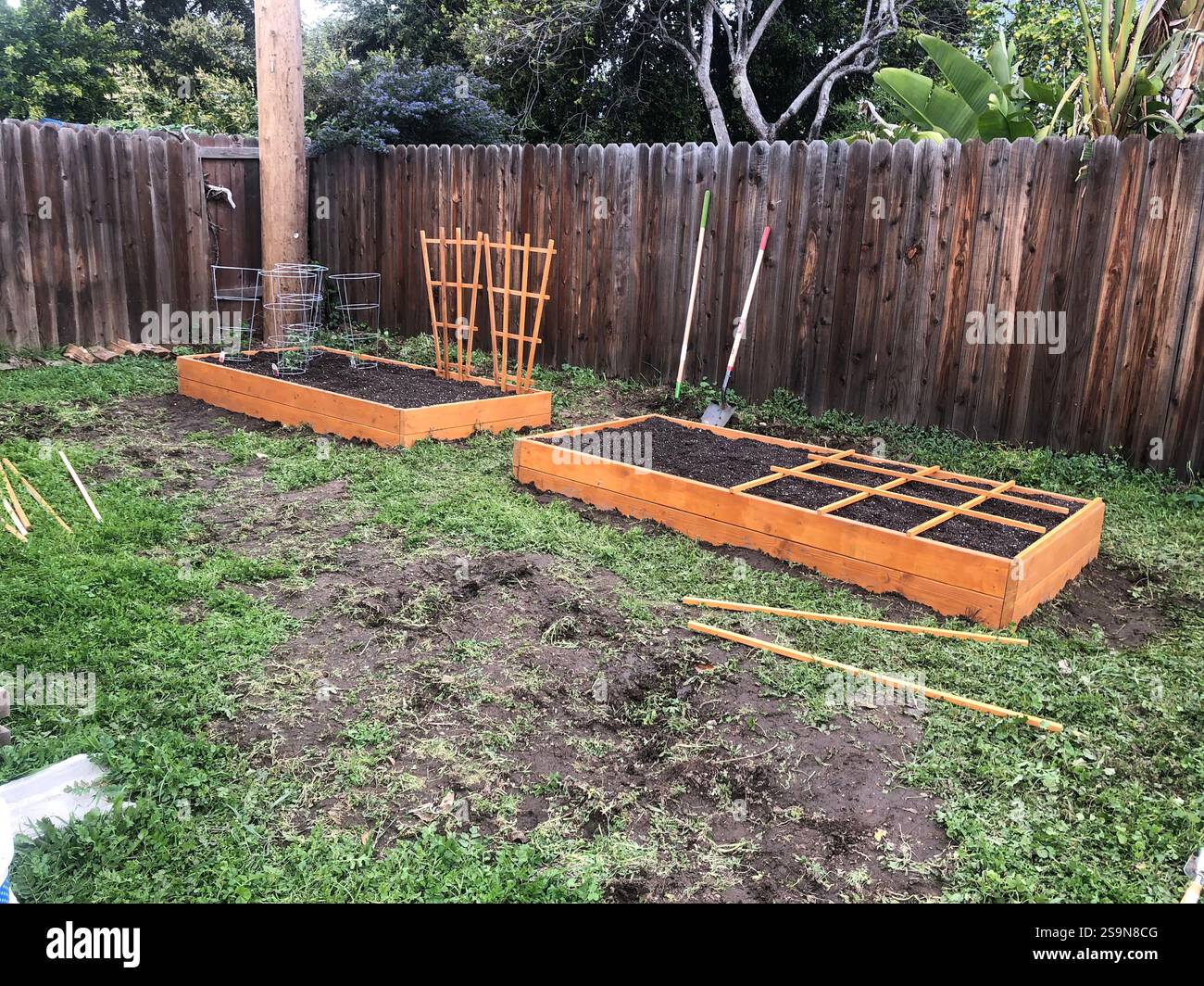 Two raised beds in spring ready for planting in backyard Stock Photo ...