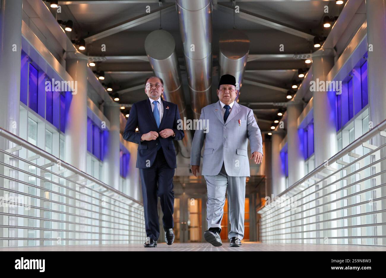 Indonesian President Prabowo Subianto, right and his Malaysian ...