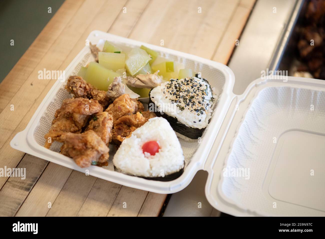 Okazuya to go container with fried chicken and onigiri rice Stock Photo ...