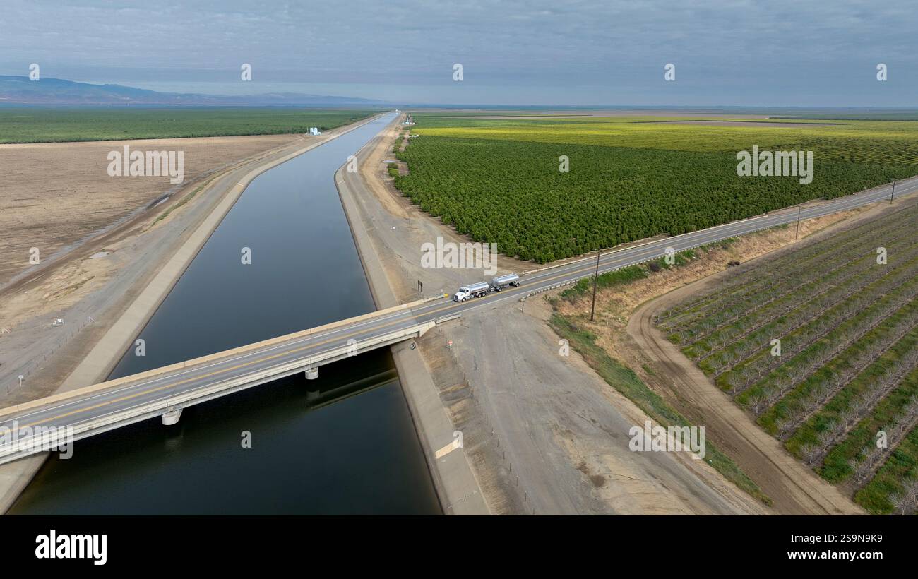 Aerial view of tanker truck passing over California aquaduct bridge ...