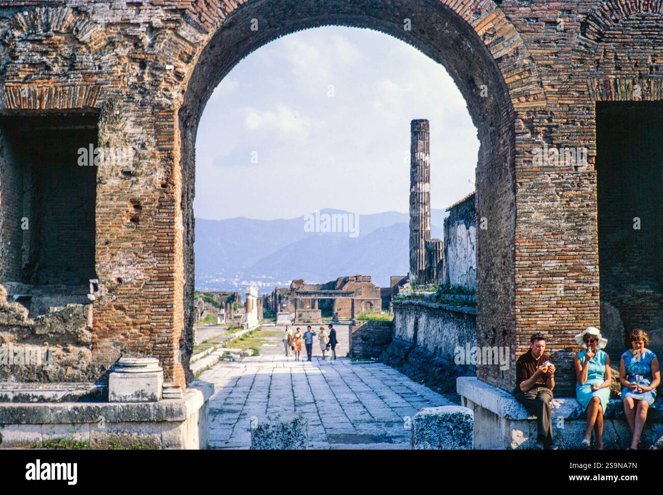 Tourists visit the Roman ruins Archaeological Park of Pompeii, Naples ...