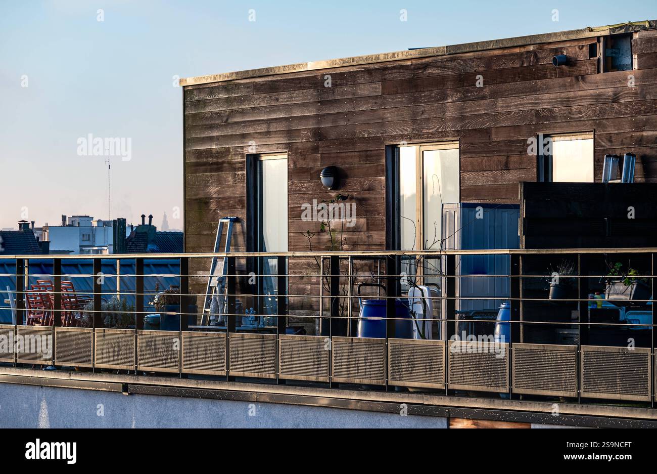 Pentehouse terrace with wooden facade on an apartment block, Jette ...