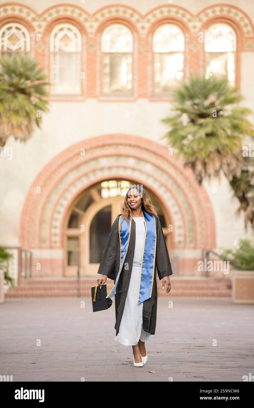 African college girl walking hi-res stock photography and images - Alamy