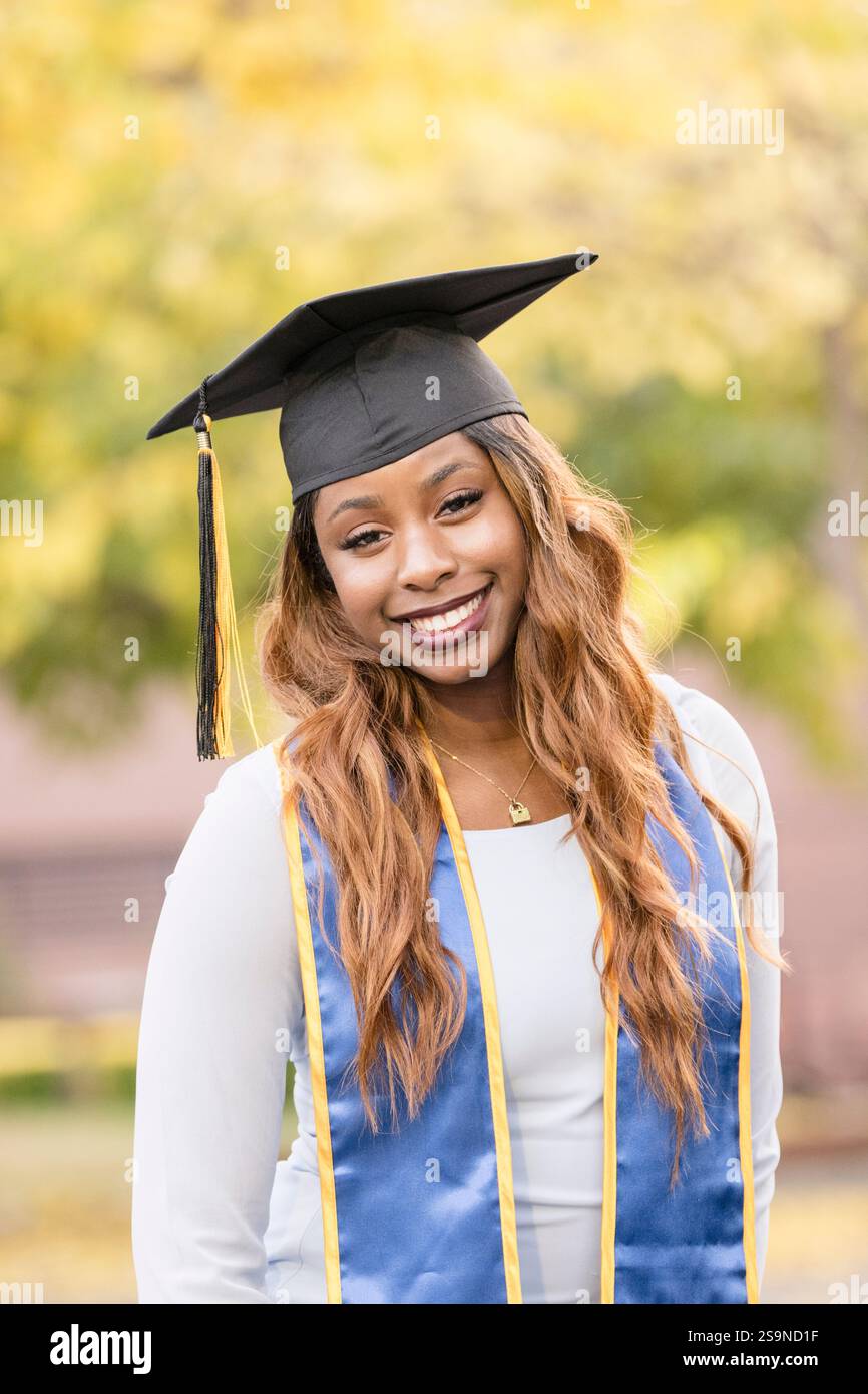 Woman wearing a graduation cap and sash Stock Photo - Alamy