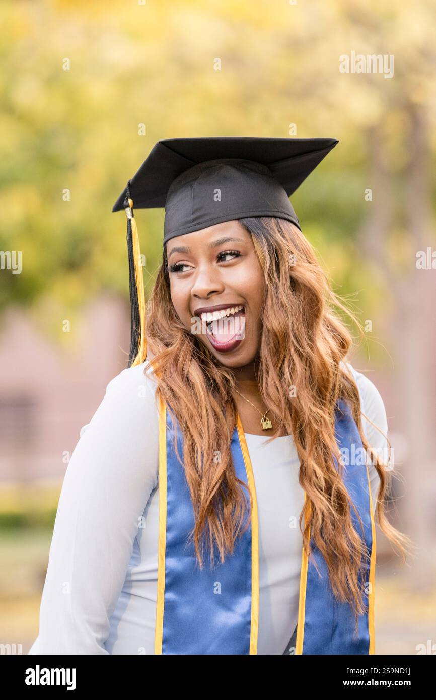 Laughing African American Woman in graduation cap Stock Photo - Alamy
