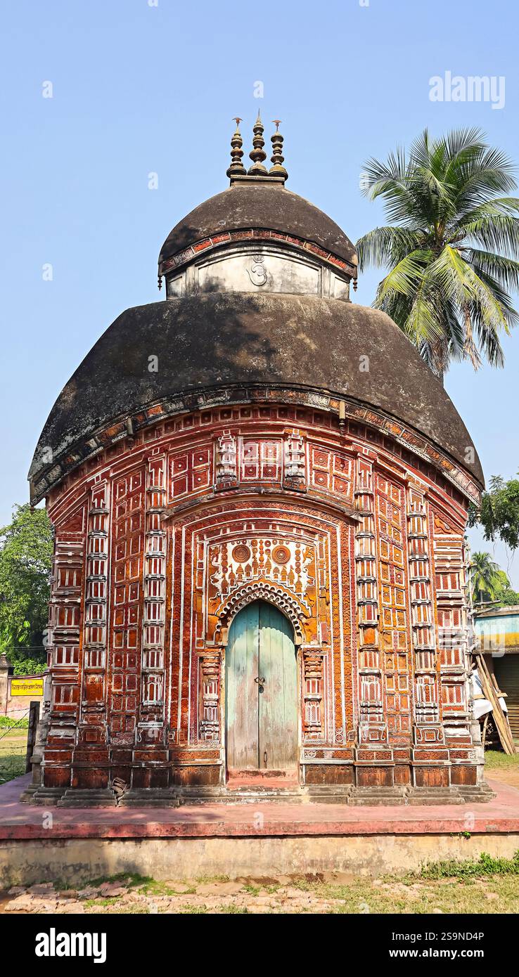 Exquisite terracotta carvings adorning the entrance of a ruined Shiva ...
