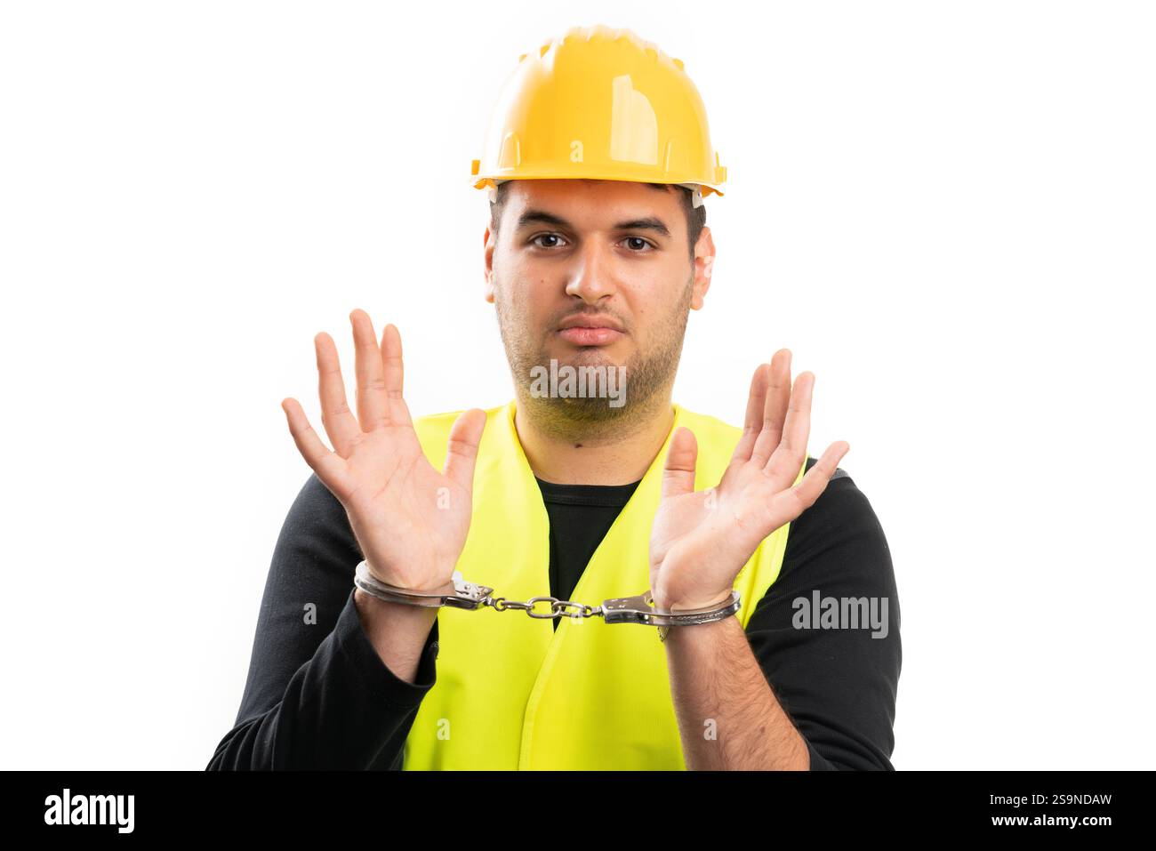 Builder man wearing protective hardhat and vest with sad expression ...