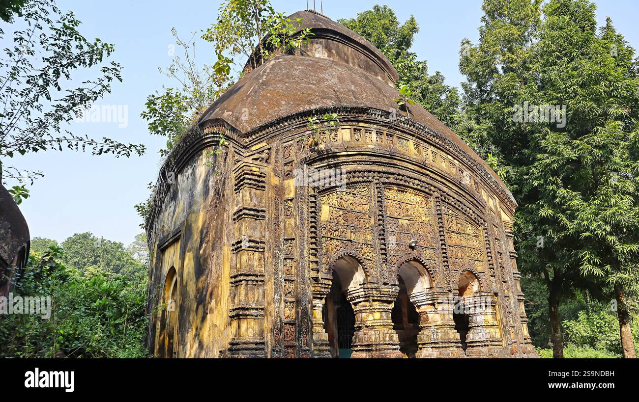 View of the ancient terracotta Damodar Temple with a triple-arched ...