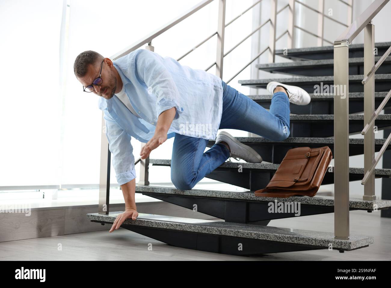 Man falling on stairs in building. Dangerous accident Stock Photo - Alamy