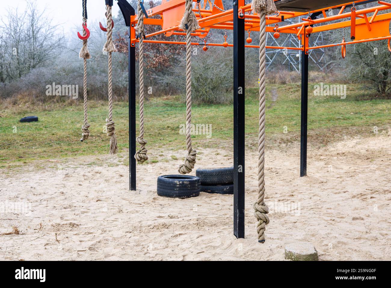 Outdoor sports ground with hanging ropes, hooks, rings for gymnastic ...