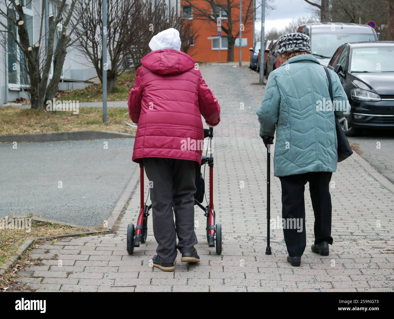 Two old women on a street with a rollator and a walking stick Stock ...
