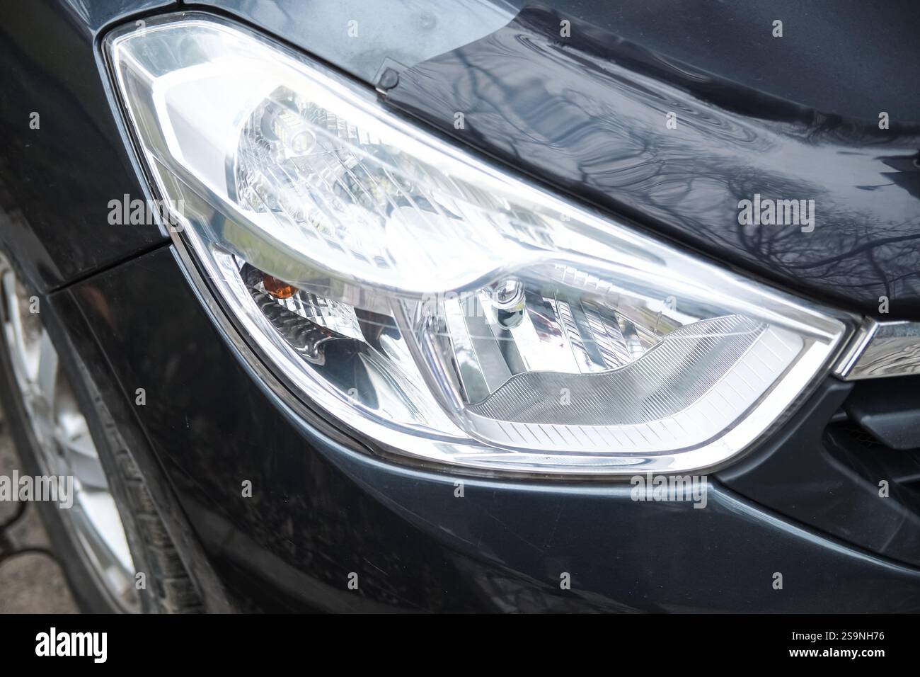close-up of the front headlight of a modern car. The headlamp has a ...