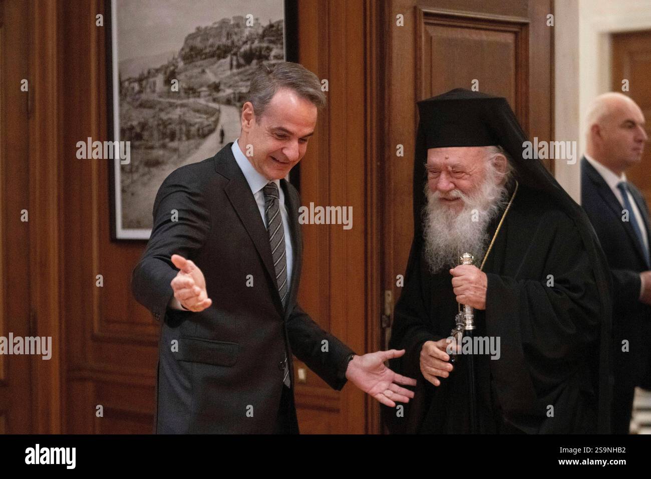 Greece's Prime Minister Kyriakos Mitsotakis, left, welcomes Archbishop ...