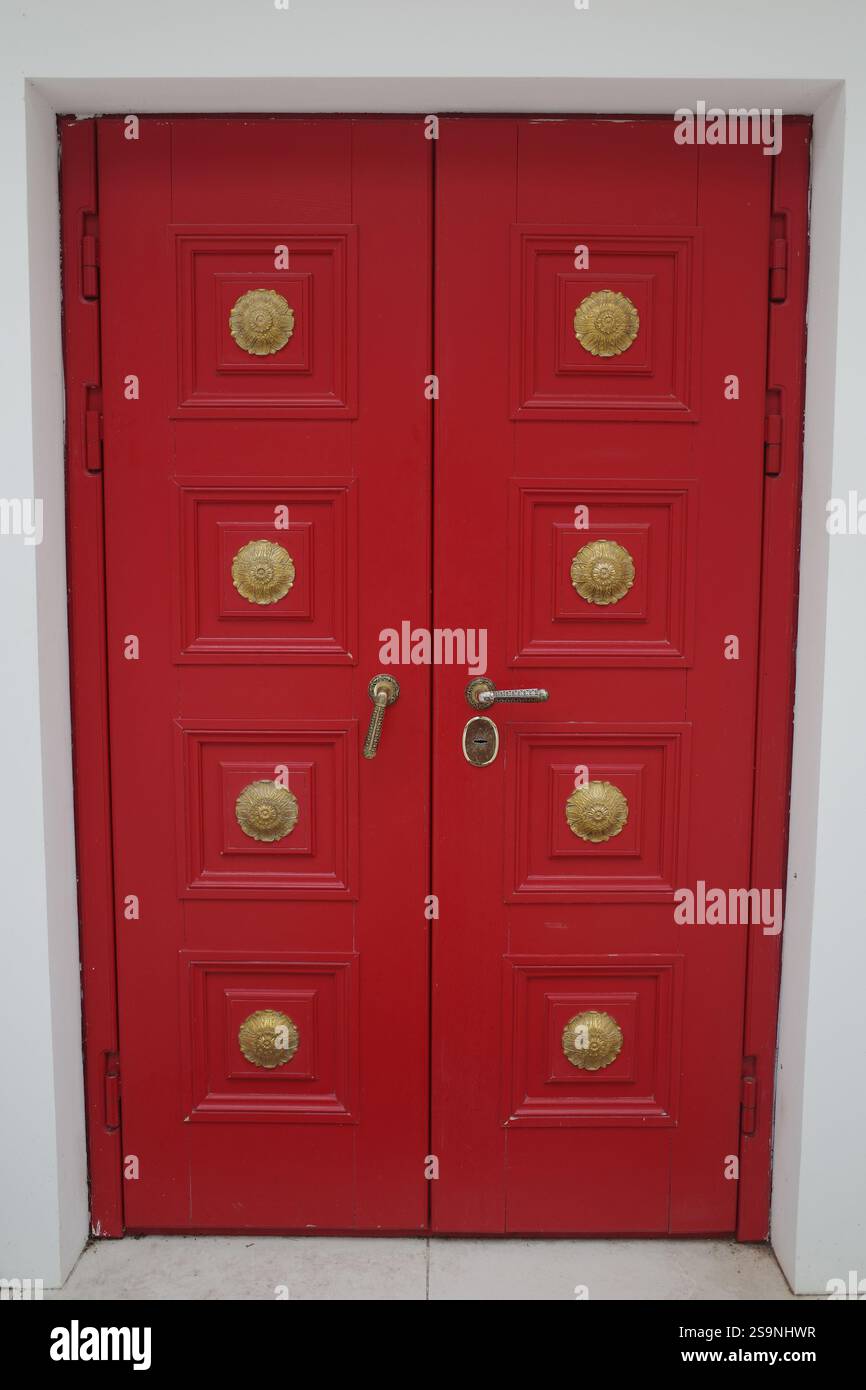 Beautiful red doors with metal decorations. The color of luxury. The ...