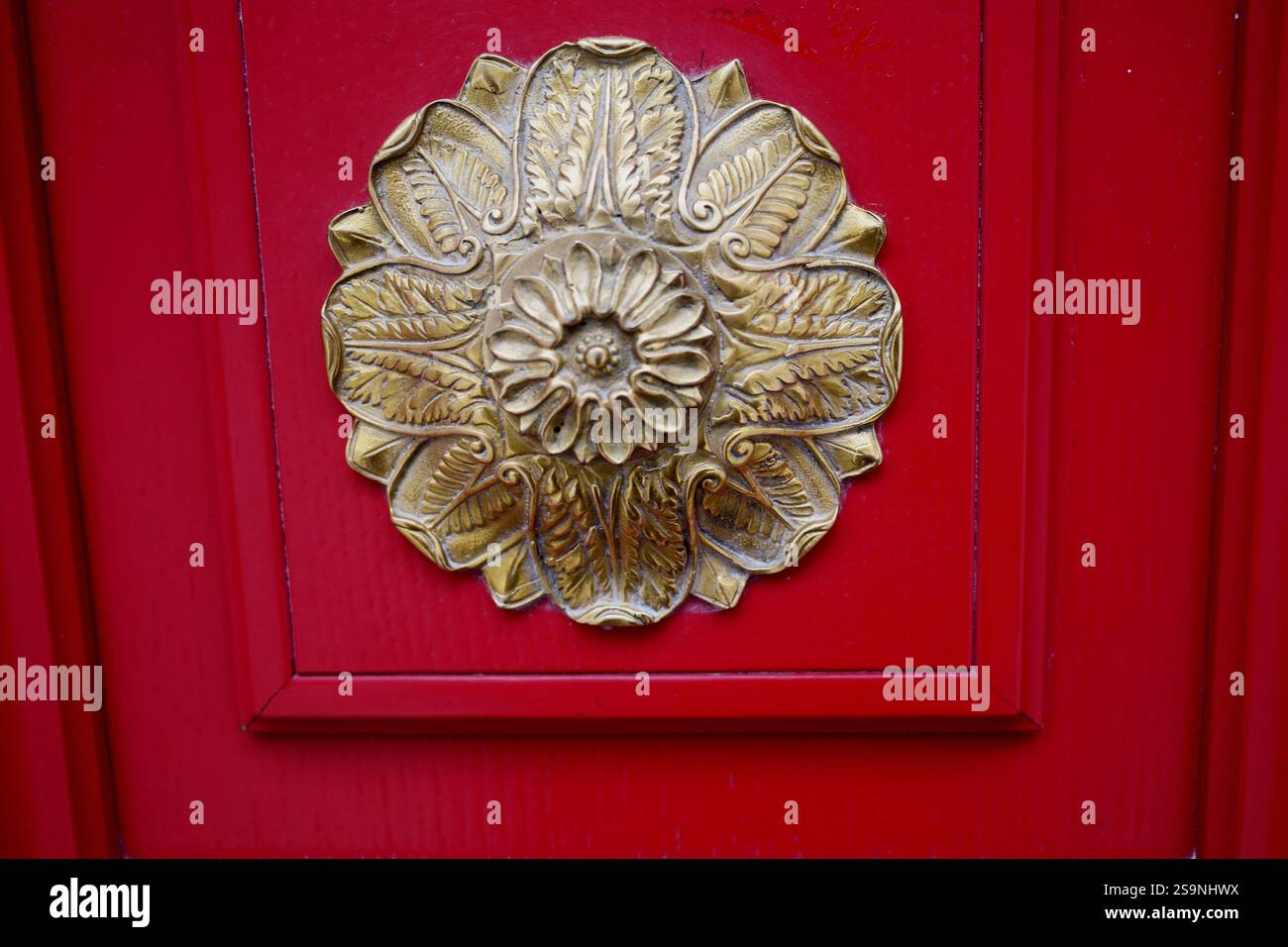 Beautiful red doors with metal decorations. The color of luxury. The ...