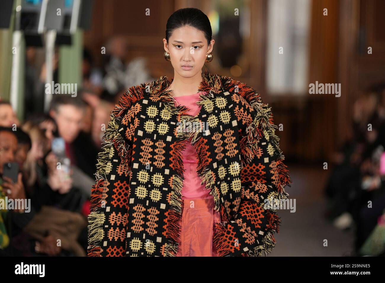 A model wears a creation during the Imane Ayissi Haute Couture Spring ...