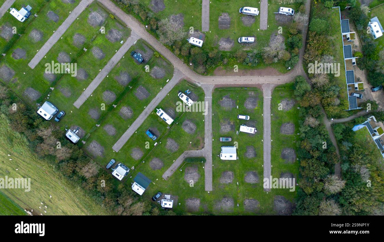 An aerial view of a campsite featuring neatly arranged pitches ...