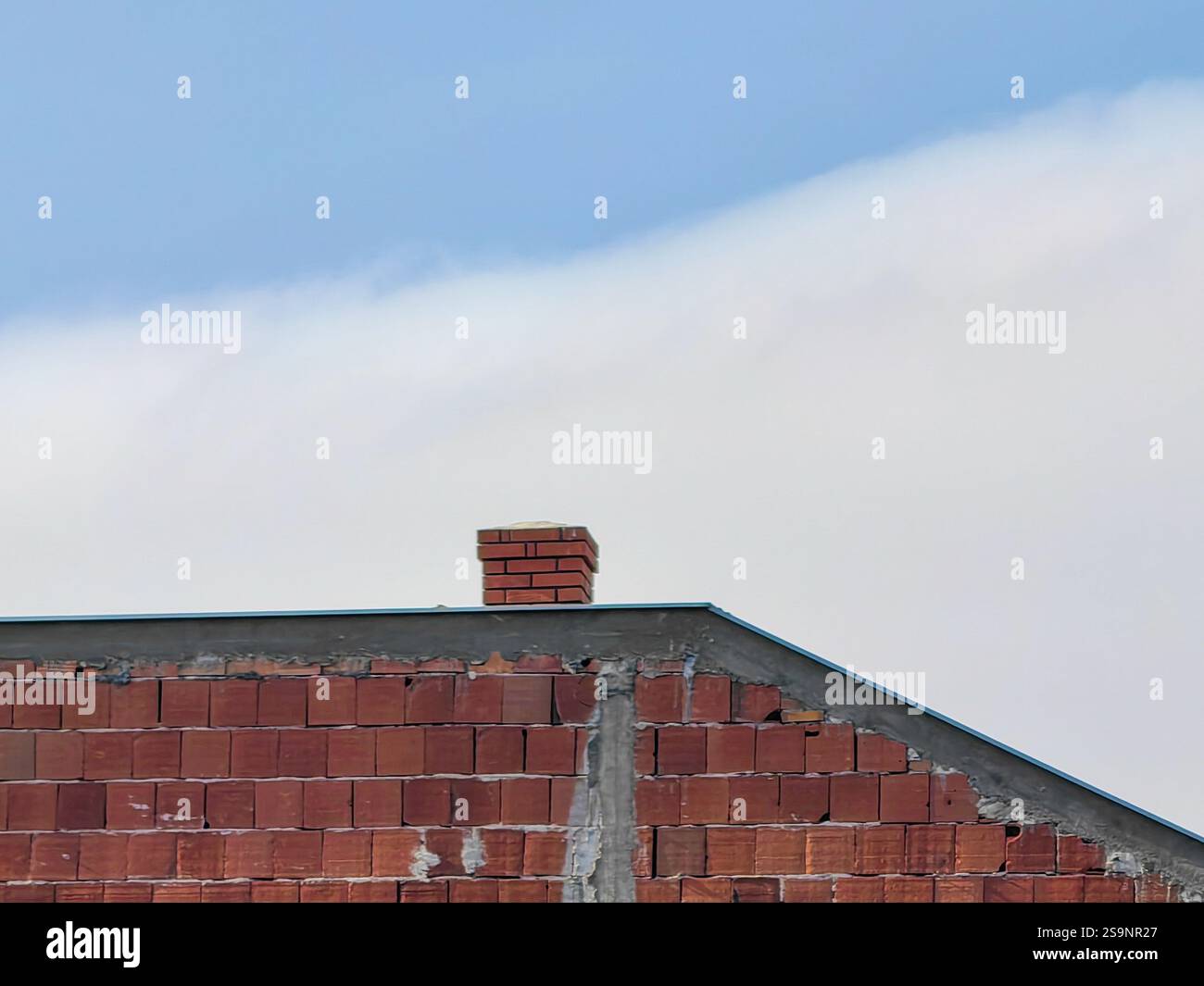 Urban Minimalism: Rooftop Under Construction with Brick Chimney Stock ...
