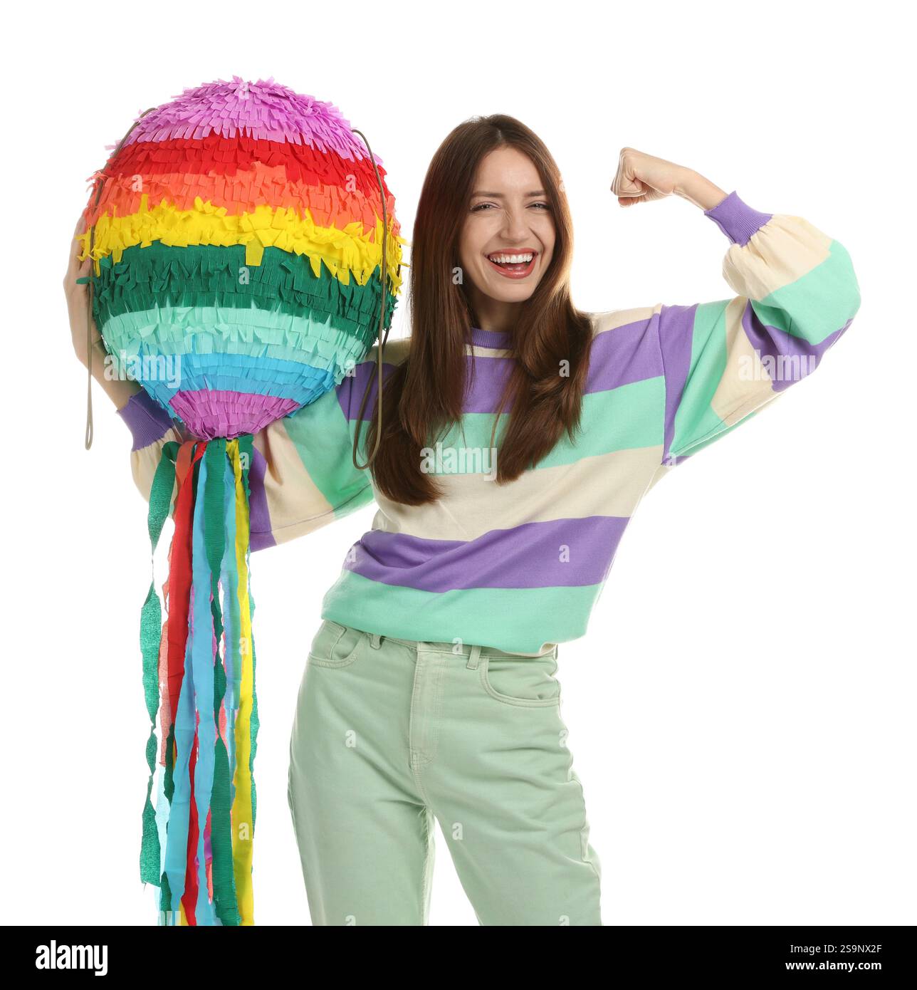 Happy woman with colorful pinata showing her strength isolated on white ...