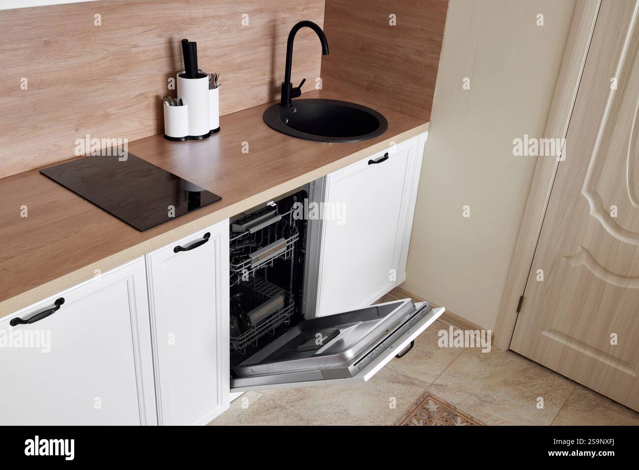 Modern kitchen design highlights sleek appliances and a minimalist ...