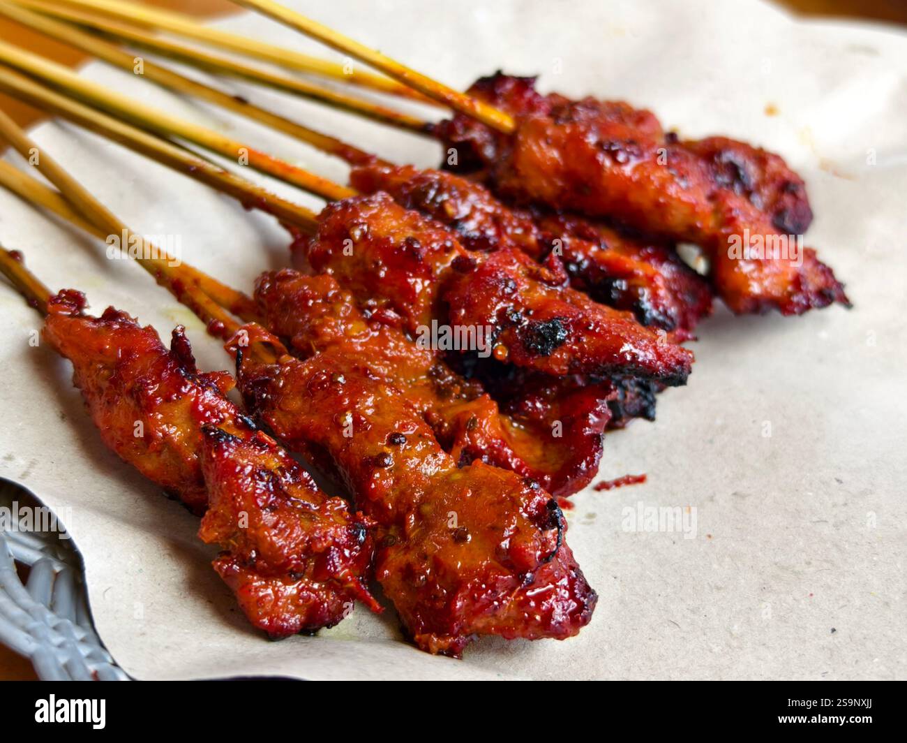 A portion of Balinese style pork satay seasoned with traditional spices ...