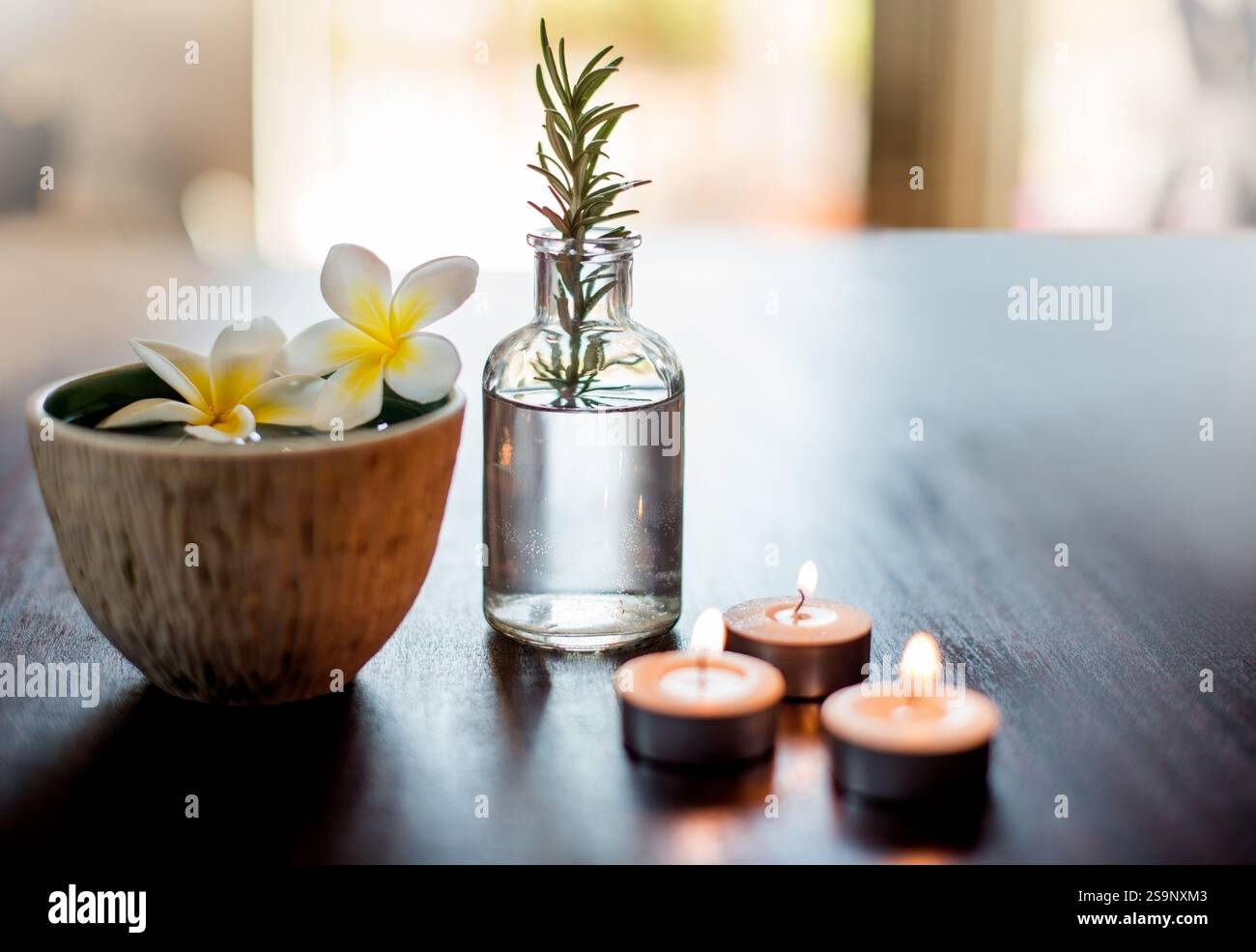 Flowers, rosemary and water in spa for self care, wellness and natural ...
