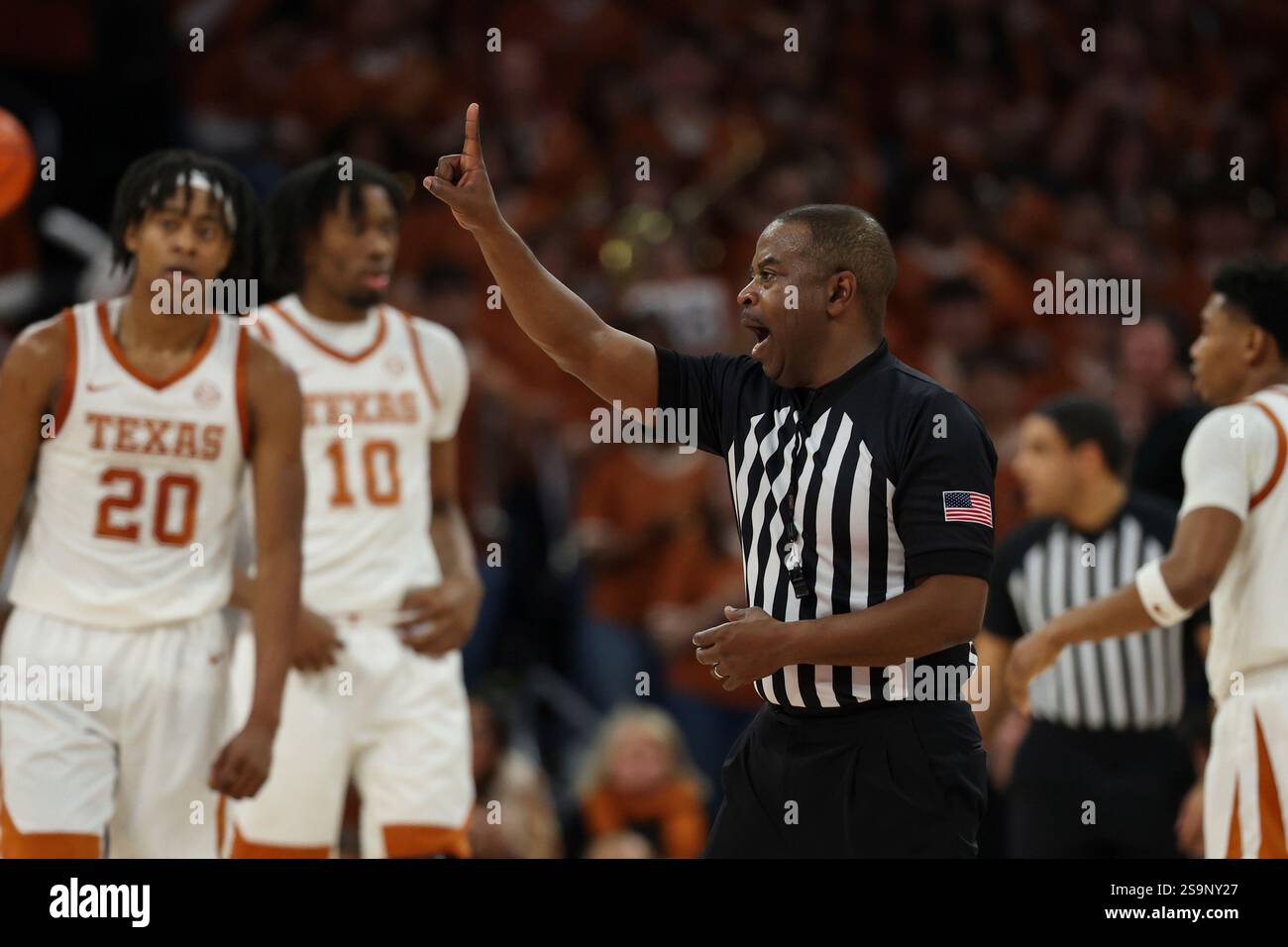 AUSTIN, TX - JANUARY 25: The referee calls a foul and holds up the ...