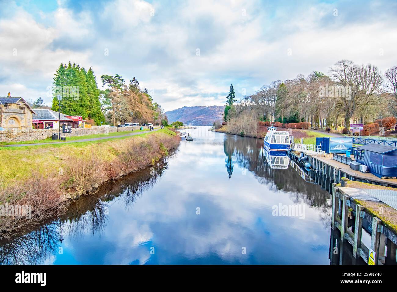 A View Along The Water Reflections On The Canal Entrance to Loch Ness ...