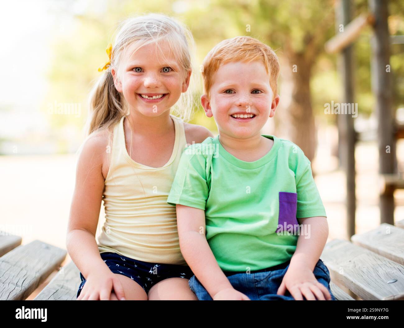 Happy, portrait and children relax in park for bonding, connection or ...