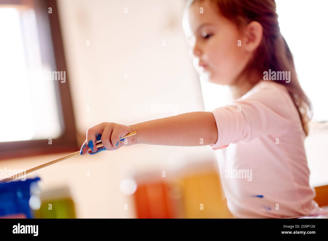 Painting, mess and creative with girl in house for child development ...