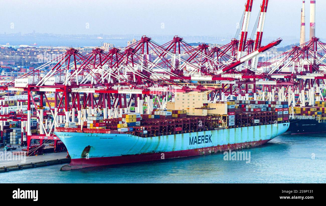 QINGDAO, CHINA - JANUARY 27, 2025 - A cargo ship loads containers at ...