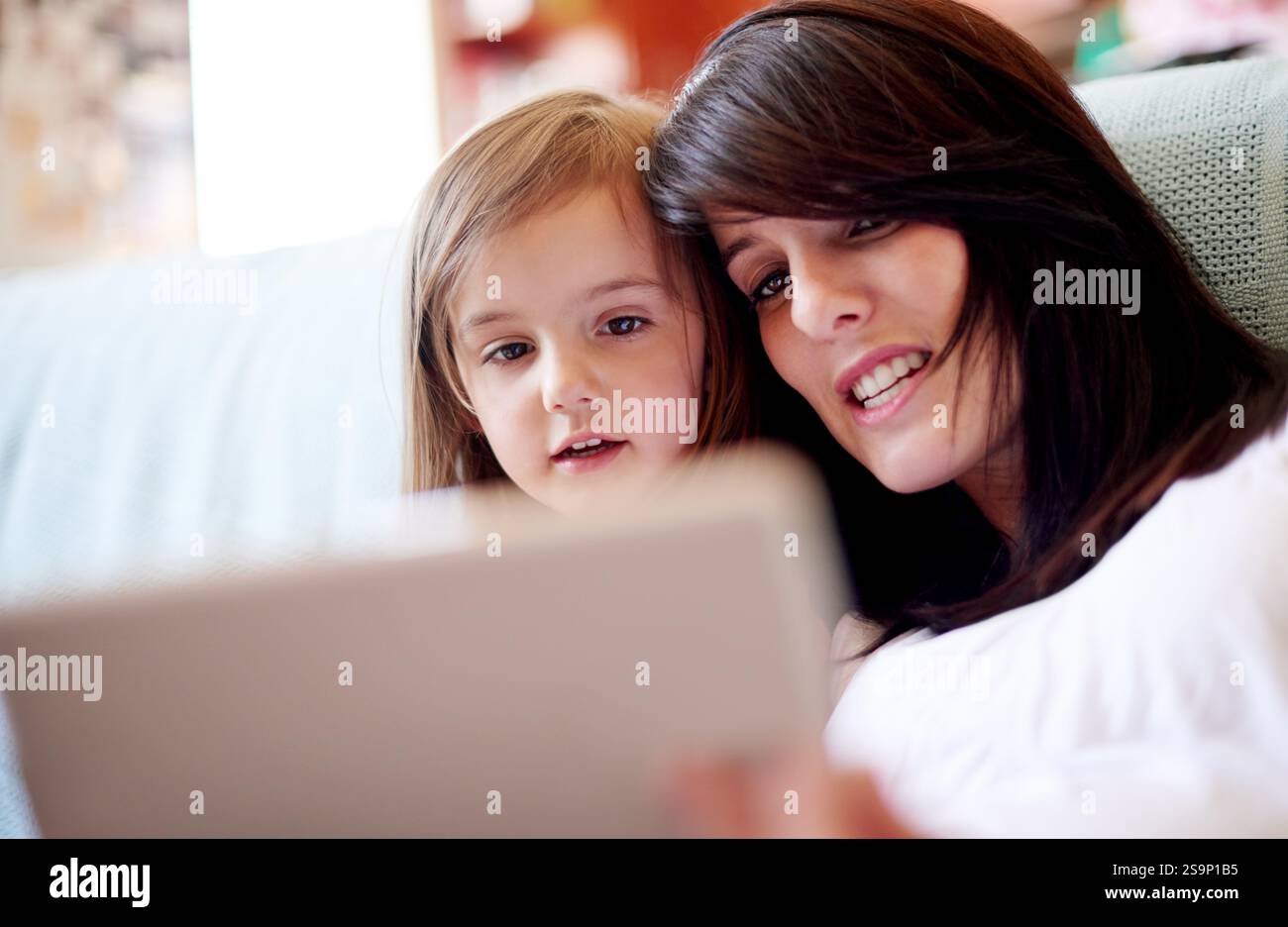Tablet, elearning and mother with kid on sofa in living room for ... Tablet, elearning and mother with kid on sofa in living room for ...