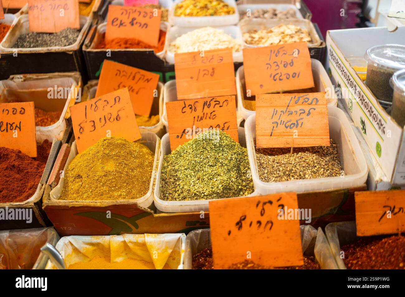 A set of various ground spices in bags at a market – turmeric, barberry ...