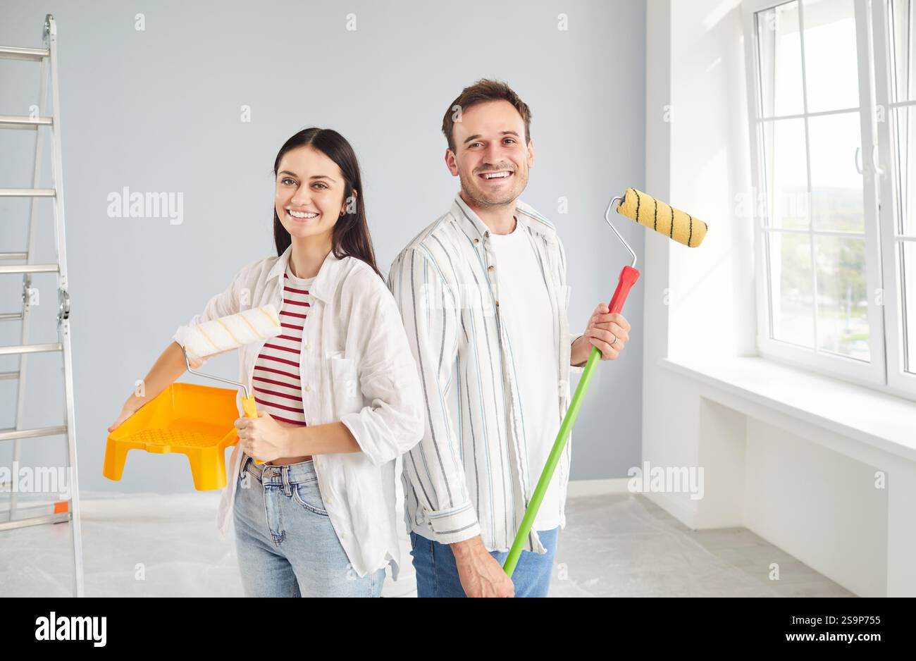 Young couple, new family planning interior design, happy painters or ...