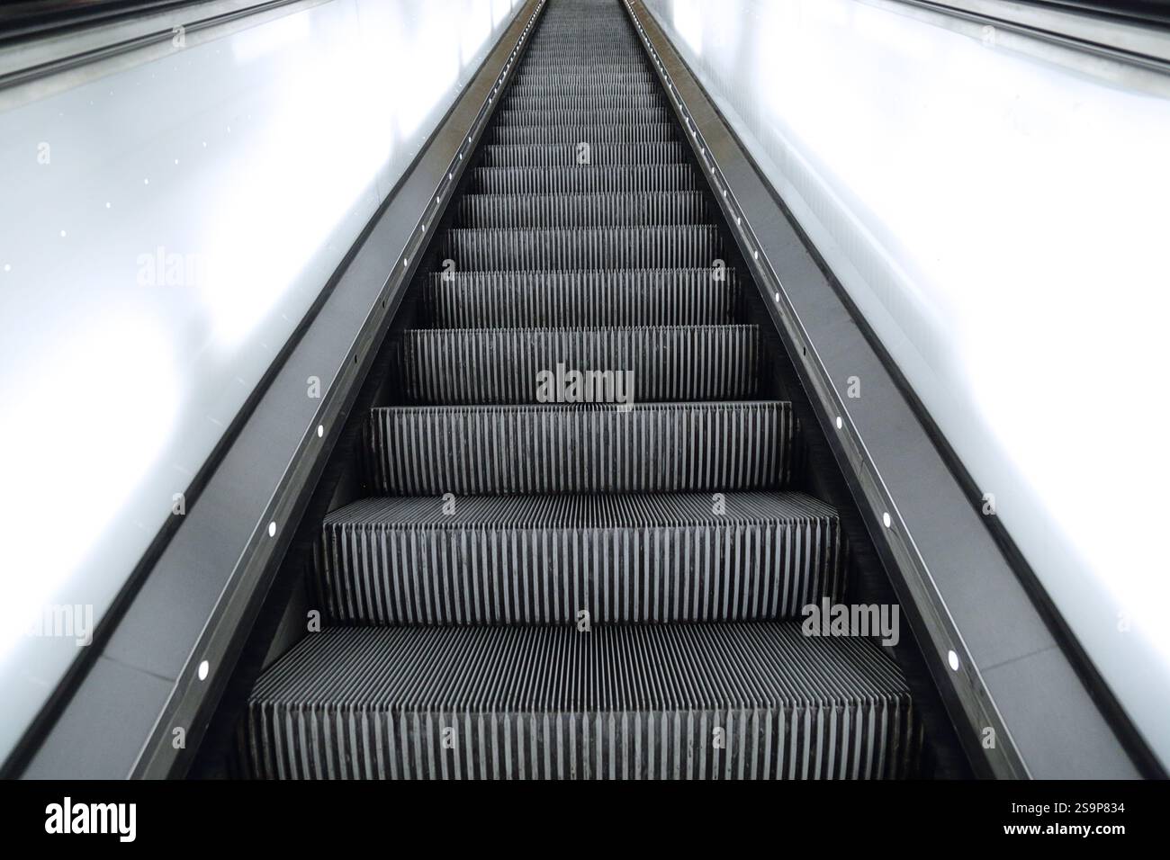 Escalators traveling in a upward direction Stock Photo - Alamy