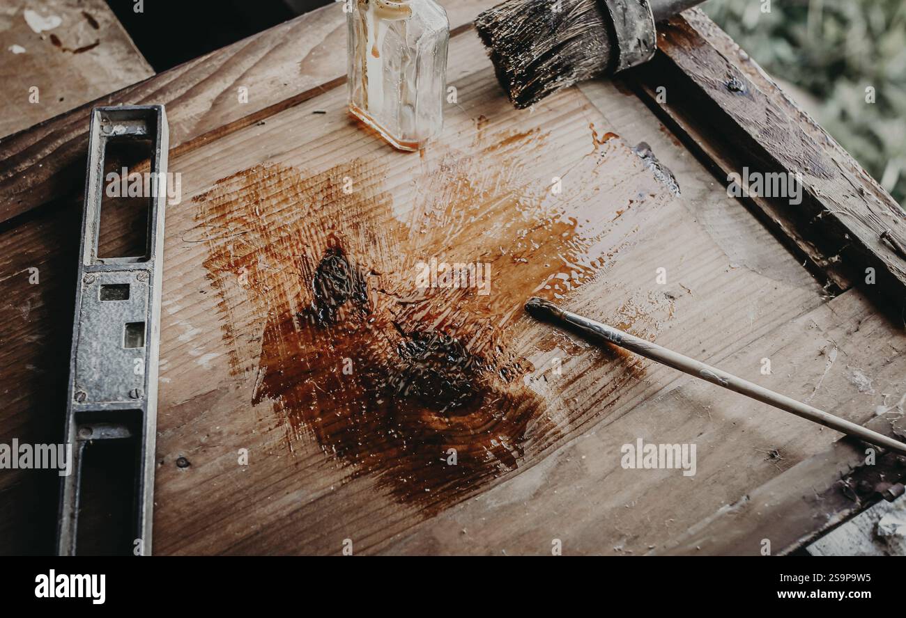 Wood texture with stains, a brush, bottle, and a level tool Stock Photo ...