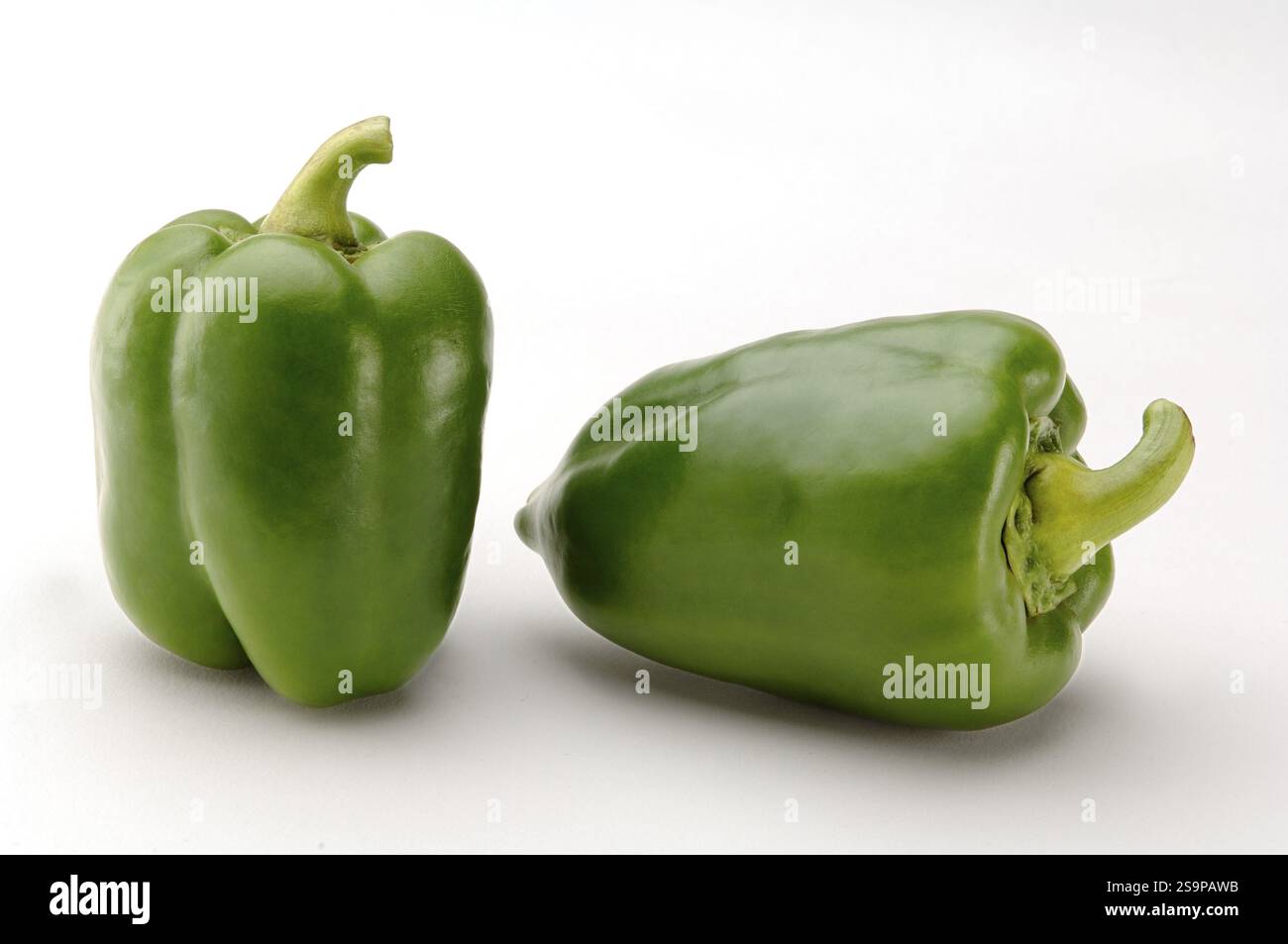 Vegetables, two pieces of green capsicum on a white background Stock ...