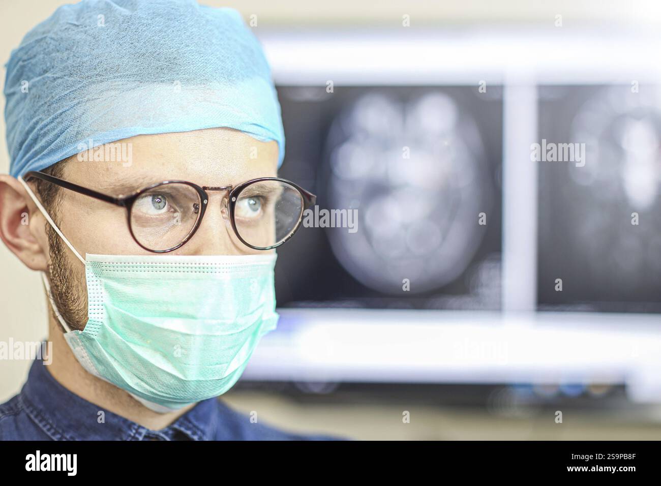 A focused surgeon wearing glasses and a mask, appearing thoughtful ...