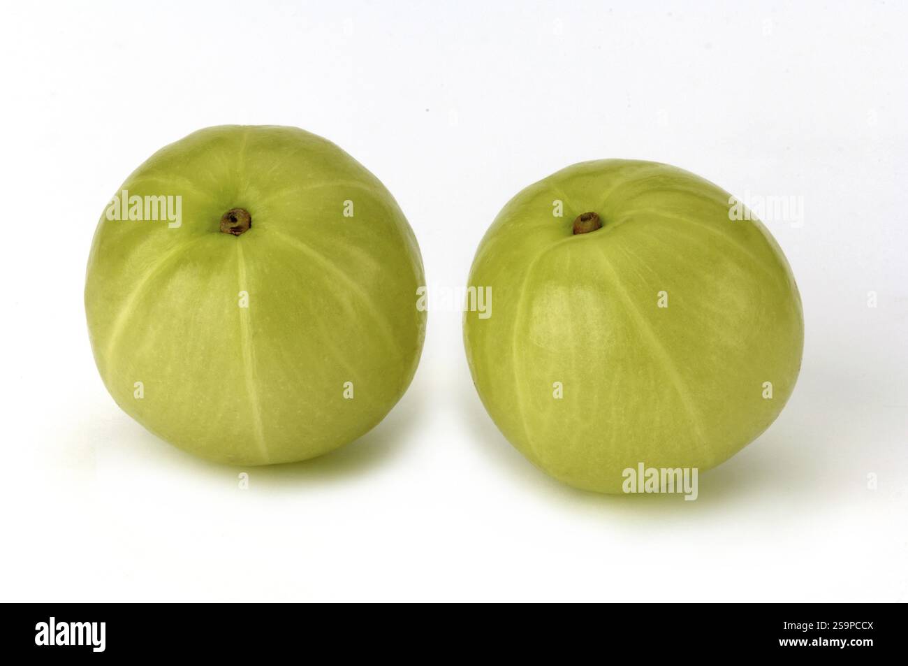 Fruits, Two Emblic gooseberries on a white background Stock Photo - Alamy